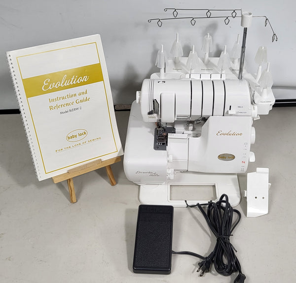 used Baby Lock Evolution air threading serger with extras – Aurora Sewing Center