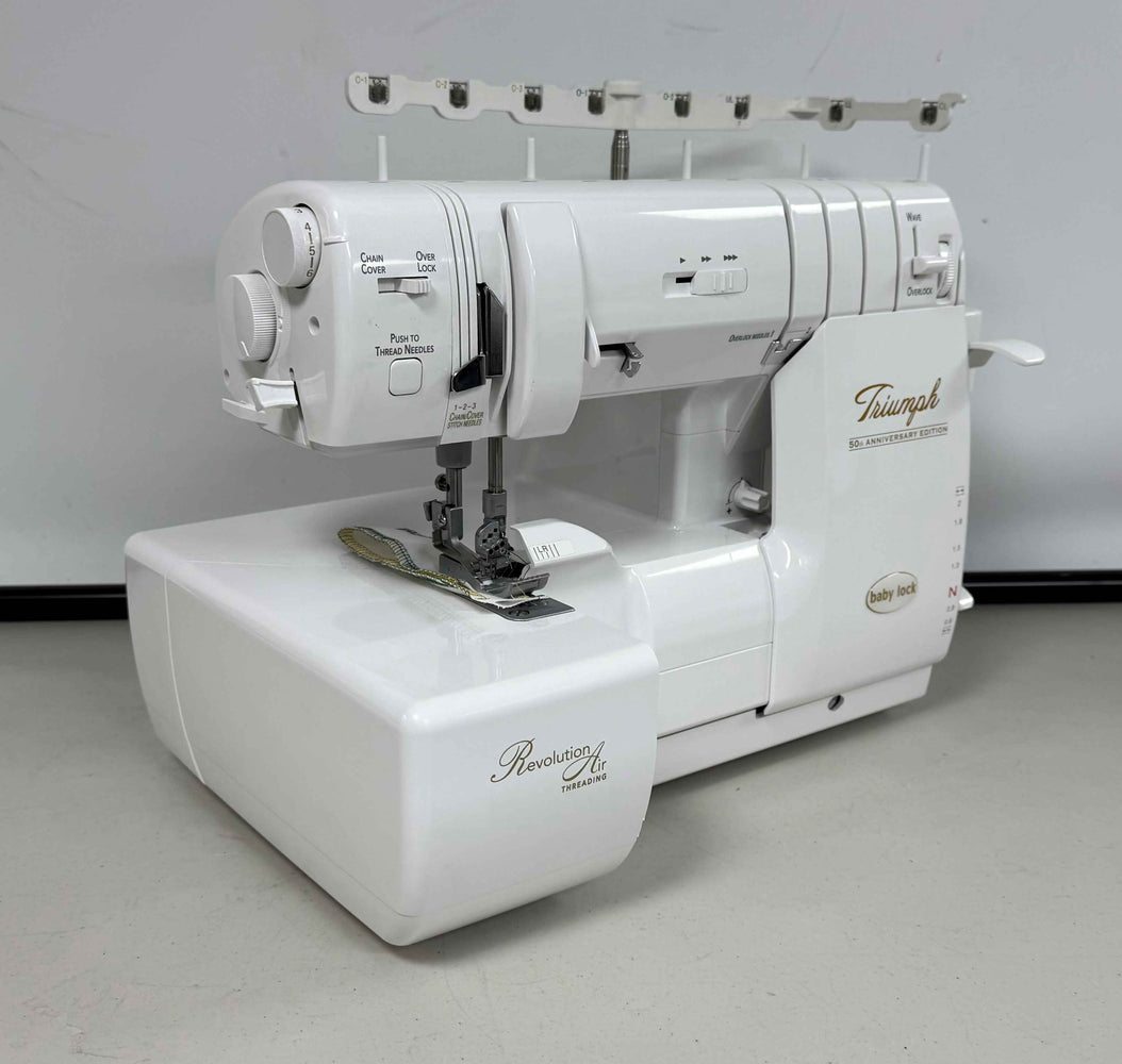 used Baby Lock Triumph combo serger with Extra Feet & Inspiration Guid ...